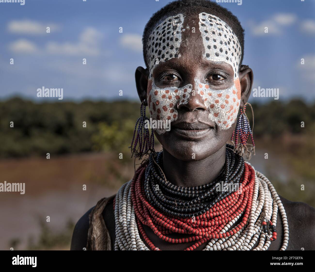 Clay is dyed using natural pigments to create the face paint. OMO ...