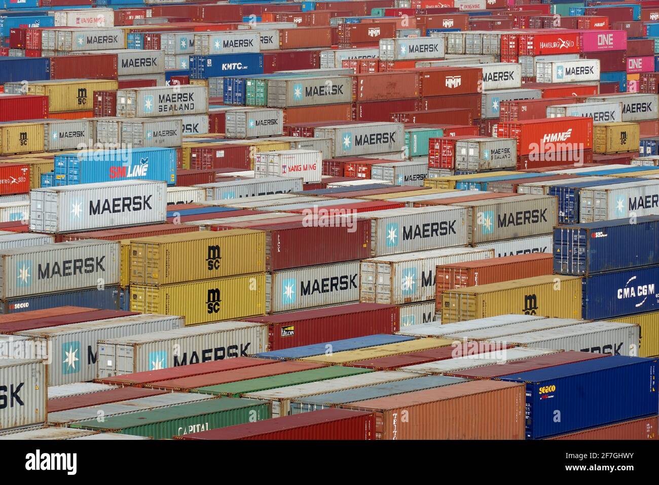 Close up view on full of colorful stacked containers in the port of ...