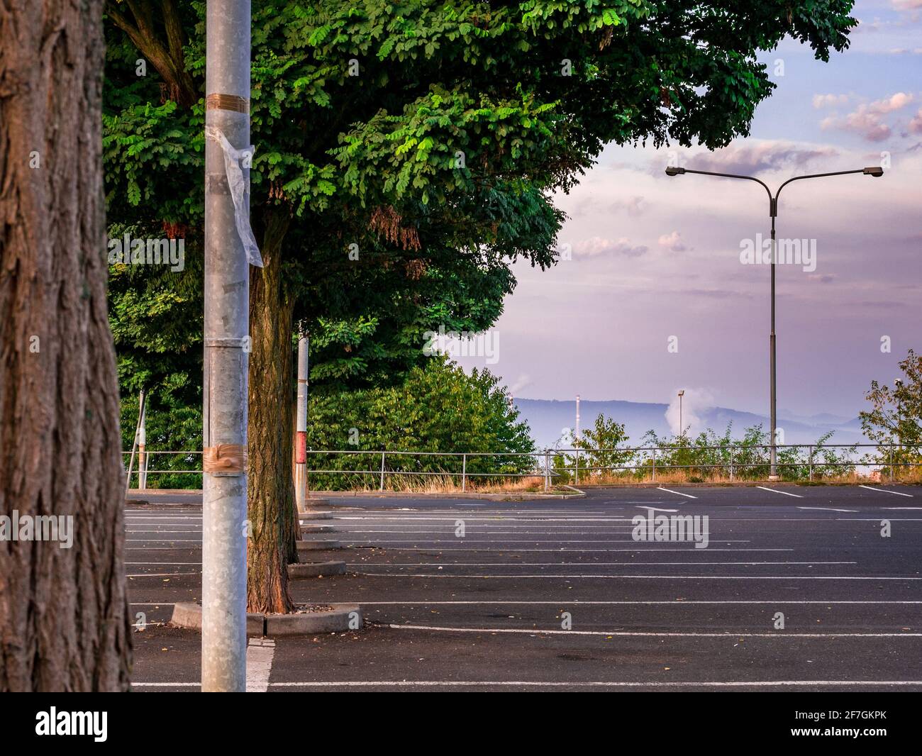 View of empty road with trees in background hi-res stock photography ...