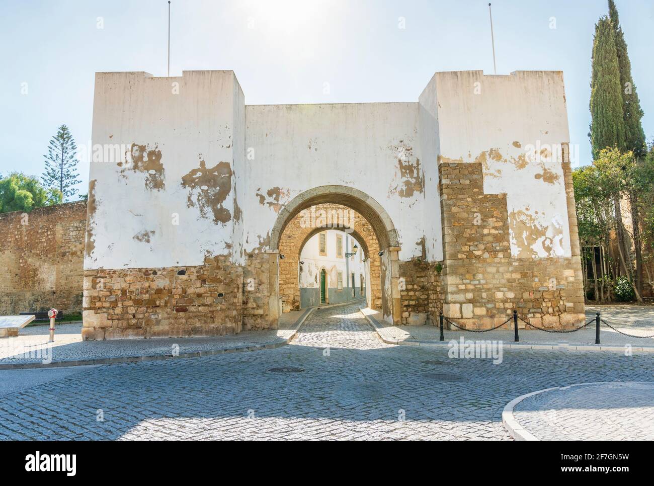 Entrance through medieval walls to historic downtown of Faro, Algarve ...