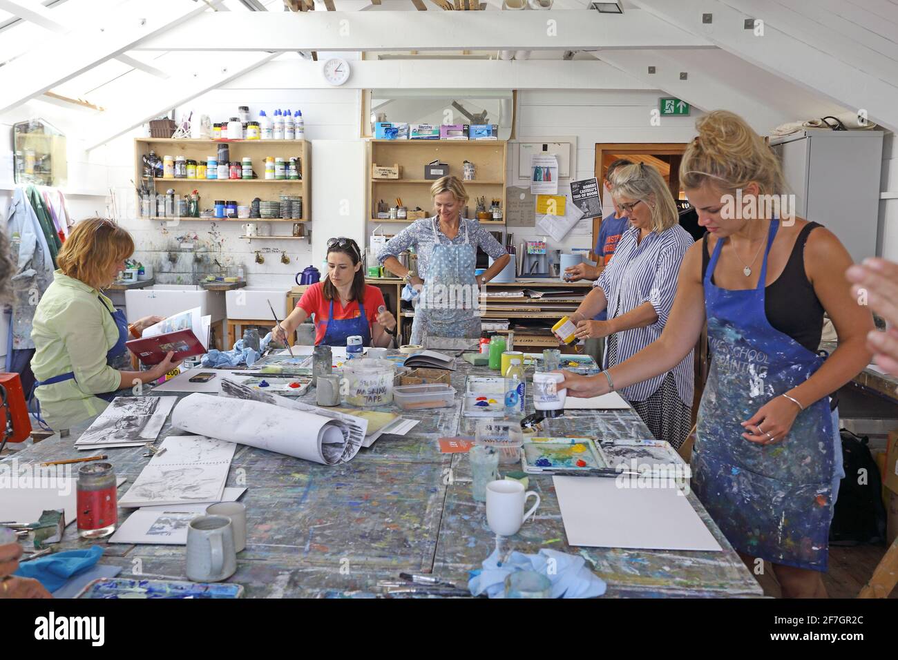 group of female fine artists painting and drawing in studio in St Ives ...