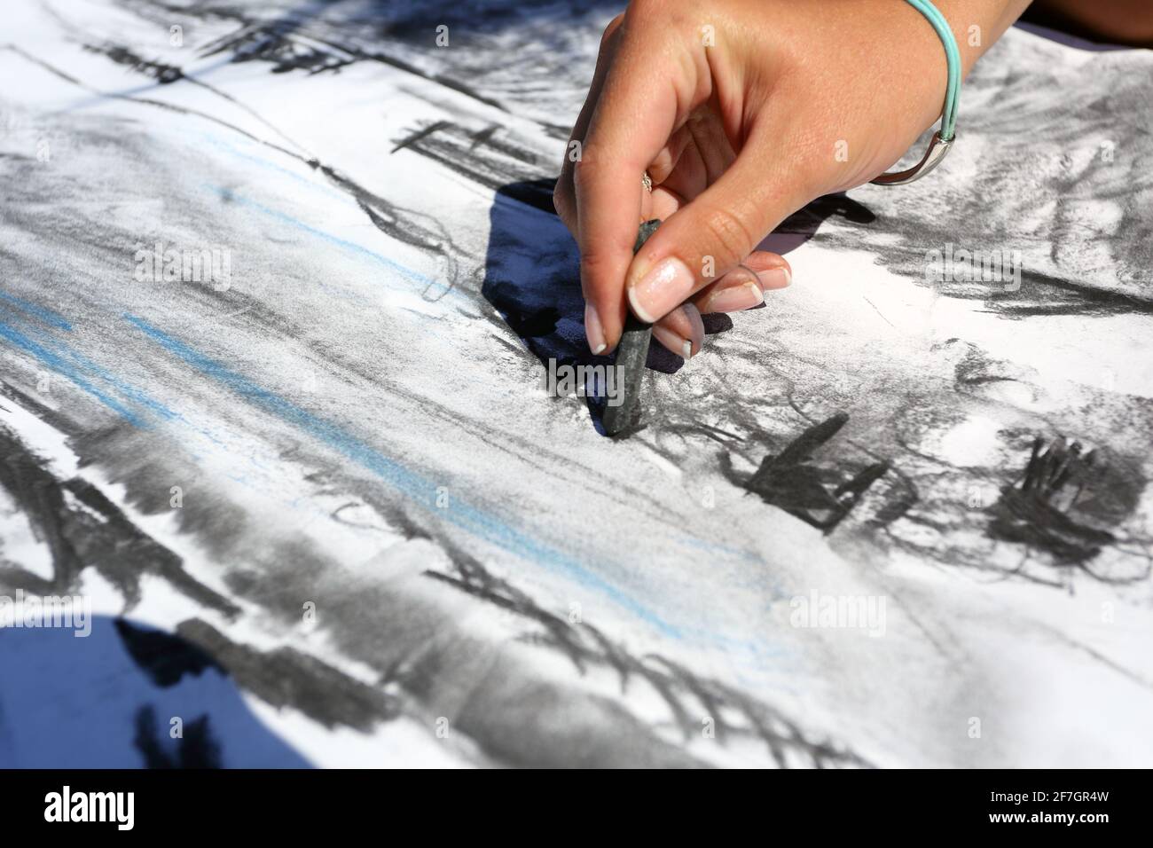 close up of female hand drawing outdoors at beach in St Ives ,Cornwall ...
