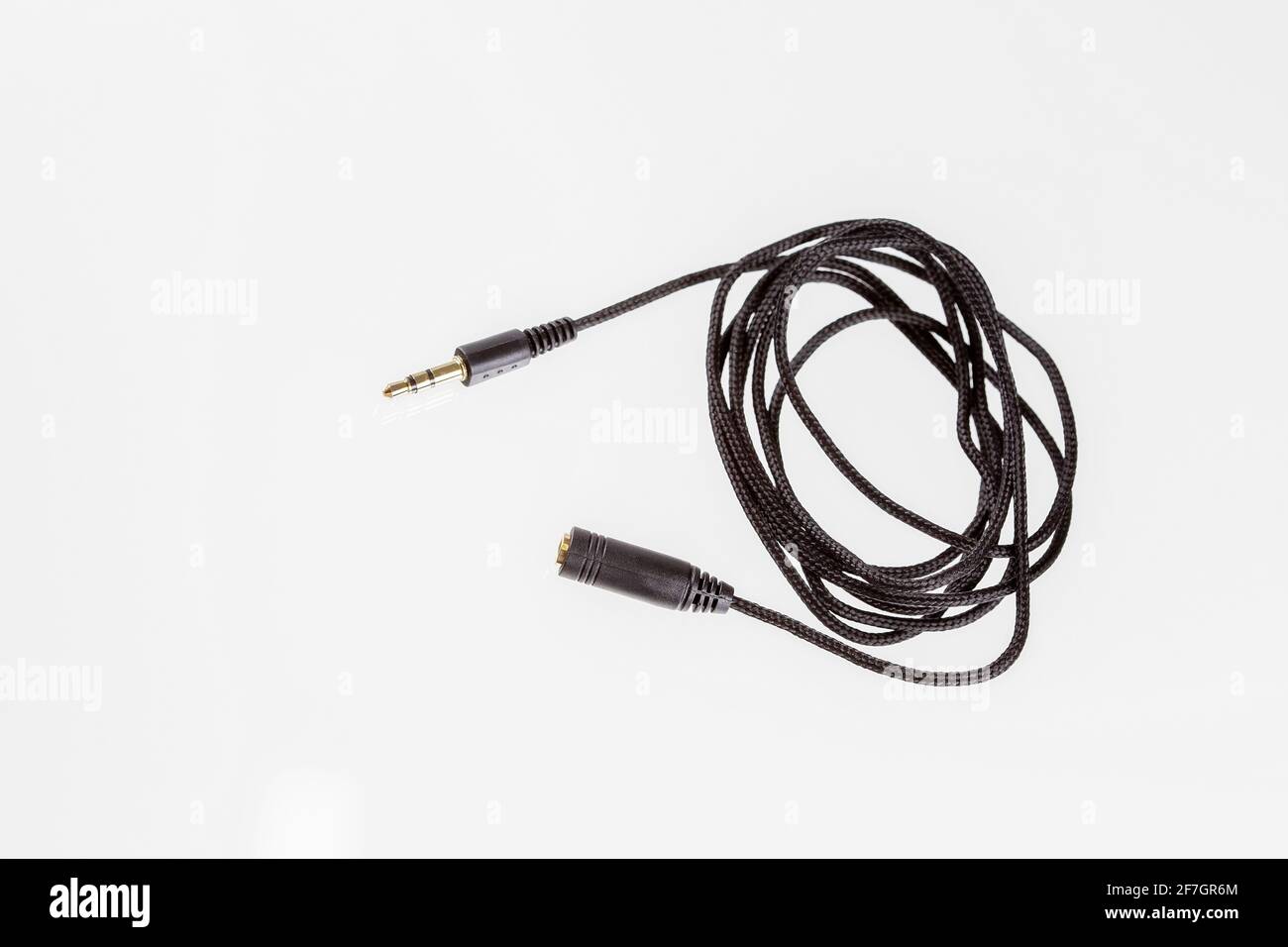 Extension cord and adapter for mobile phone headset for use with ...