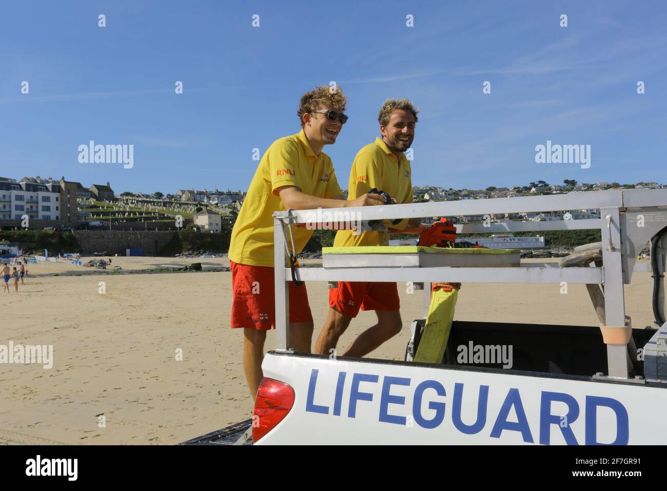 Lifeguards on an RNLI truck, Porthmeor Beach, St Ives, Cornwall, UK ...
