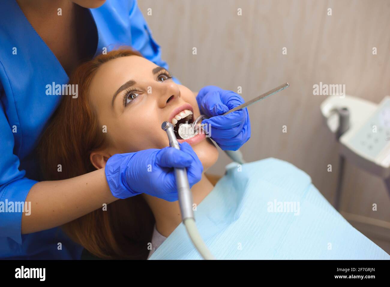 Dental inspection in clinic. Doctor in uniform checking up female ...