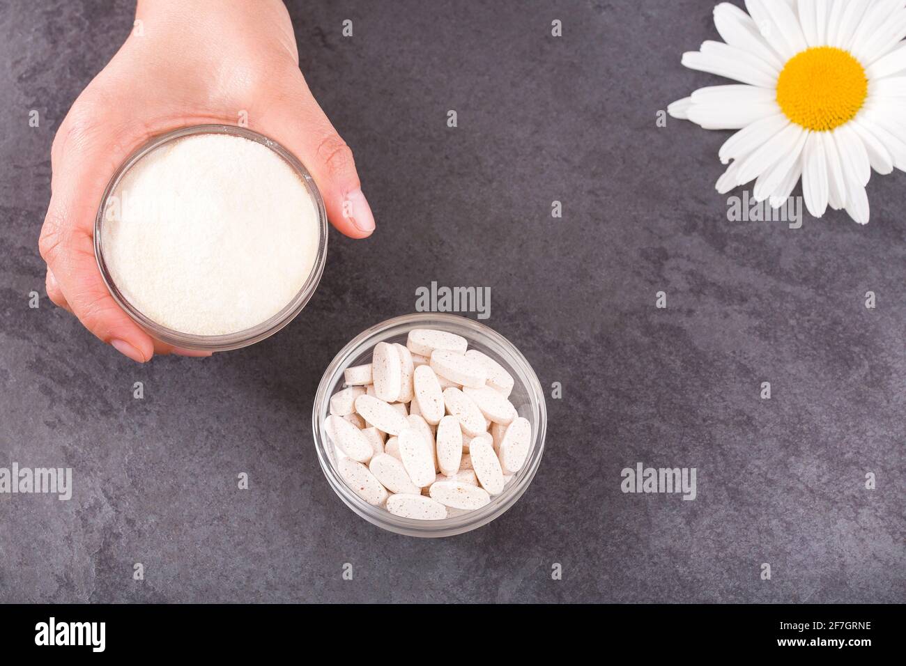 Pills and collagen protein powder - Hydrolyzed. Woman's hands Stock ...