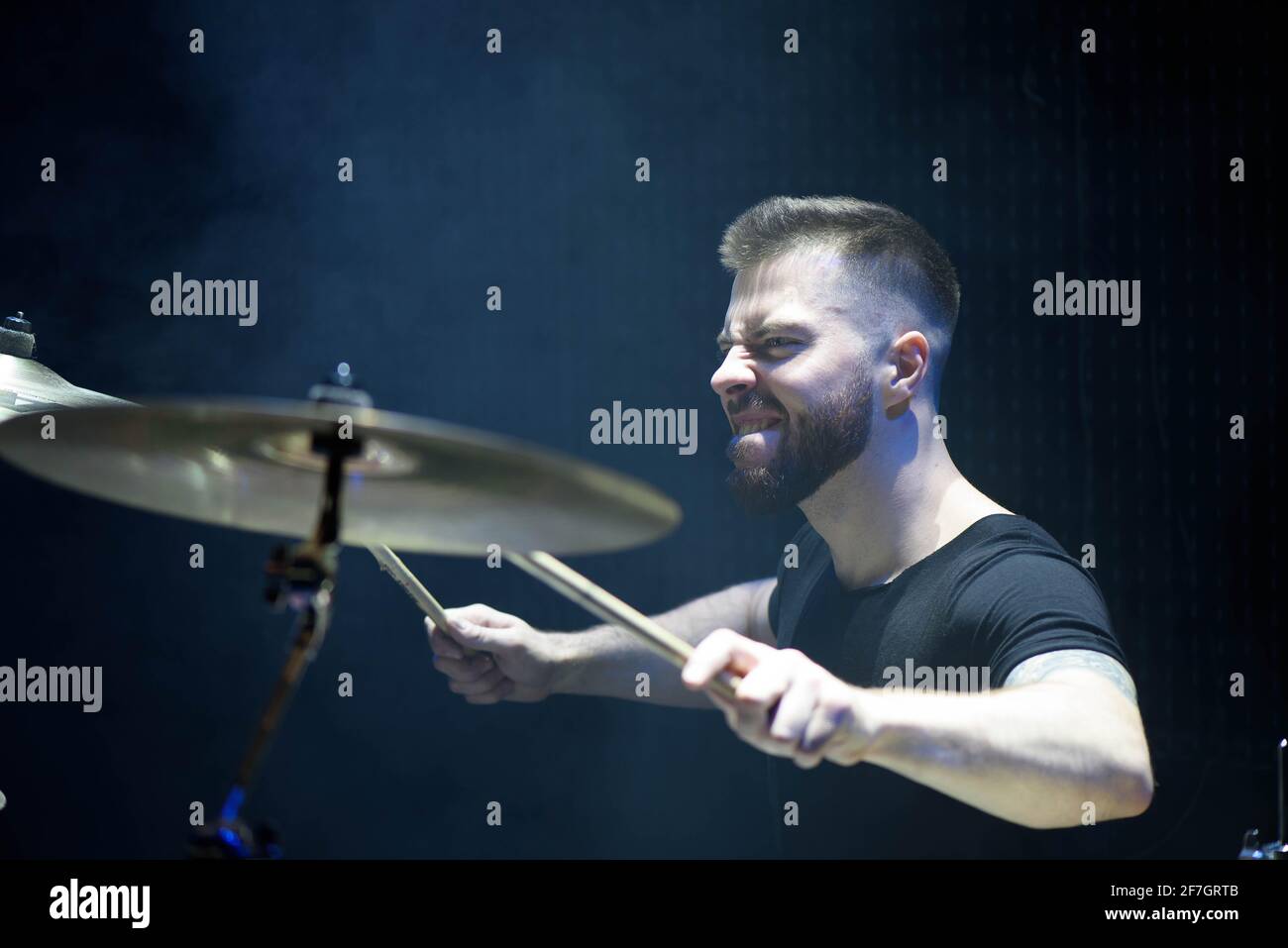 The drummer in action. A photo close up process play on a musical ...