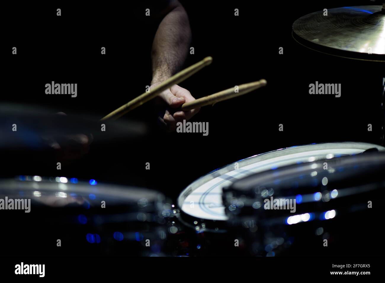 The drummer in action. A photo close up process play on a musical ...