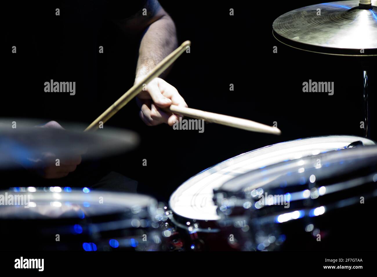 The drummer in action. A photo close up process play on a musical ...
