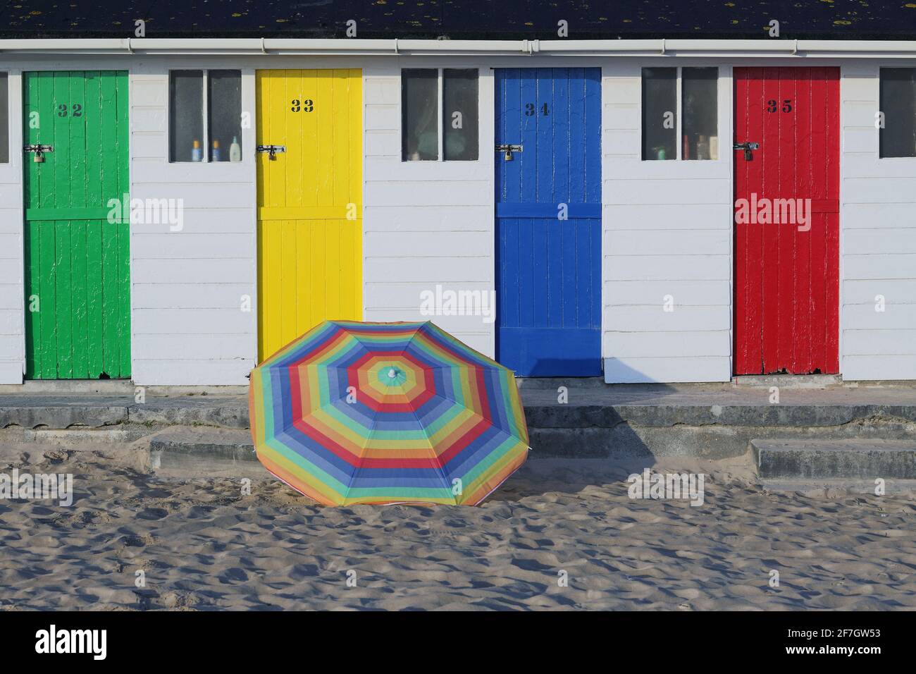 Brightly coloured beach huts on Porthminster Beach, St. Ives in ...