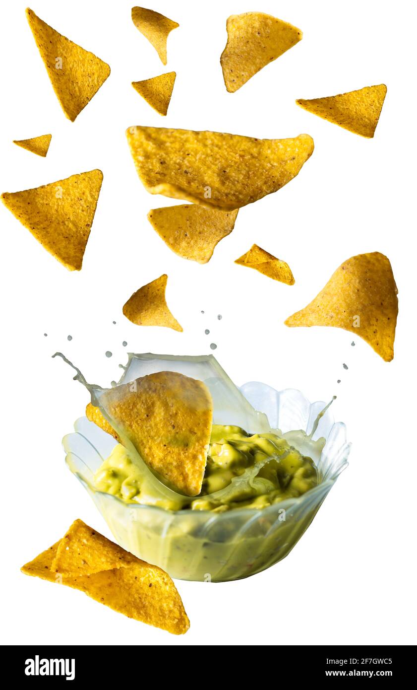 flying nachos and splashing guacamole sauce Stock Photo - Alamy