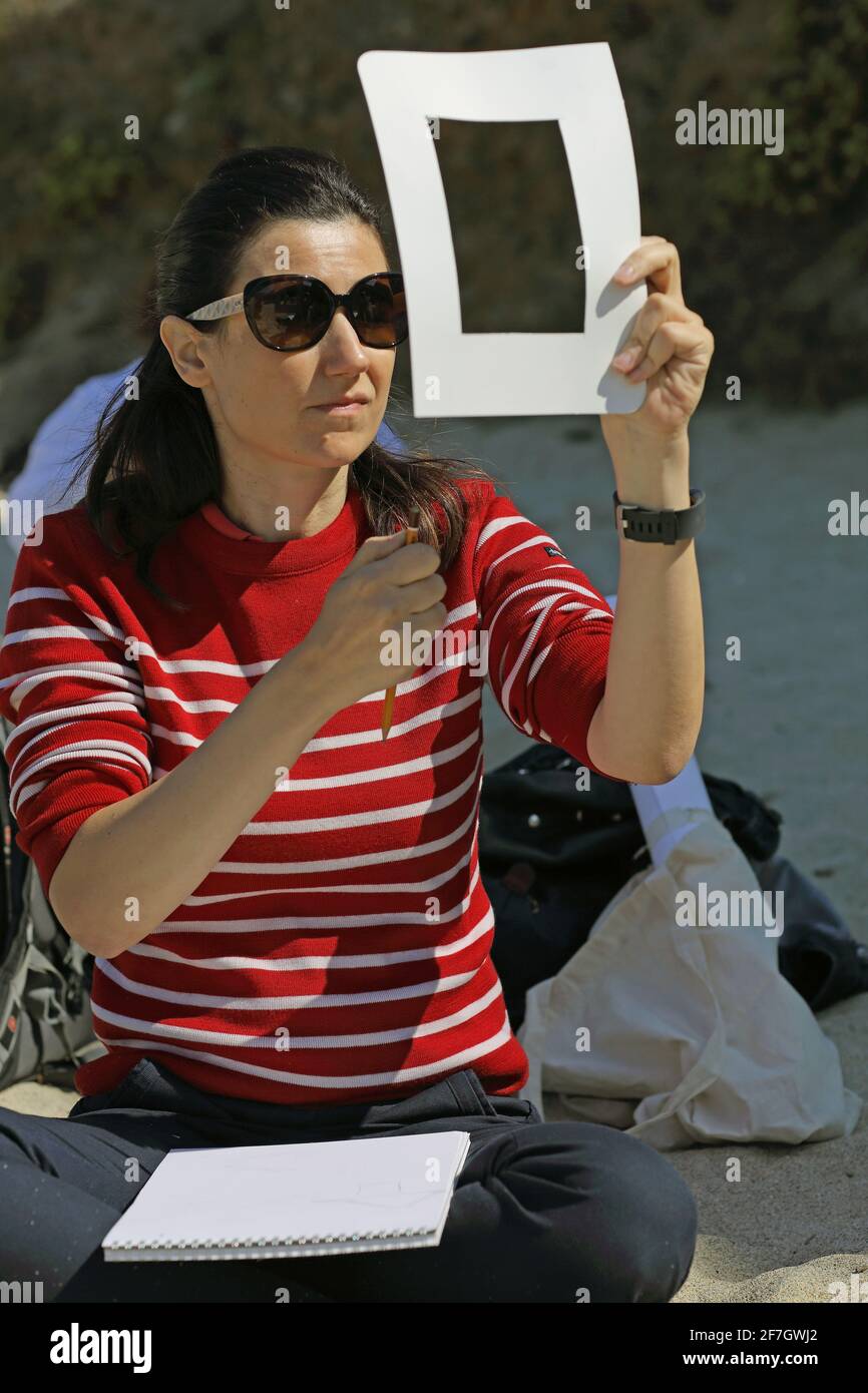 Female artists looking through frame during drawing classes in St Ives ...