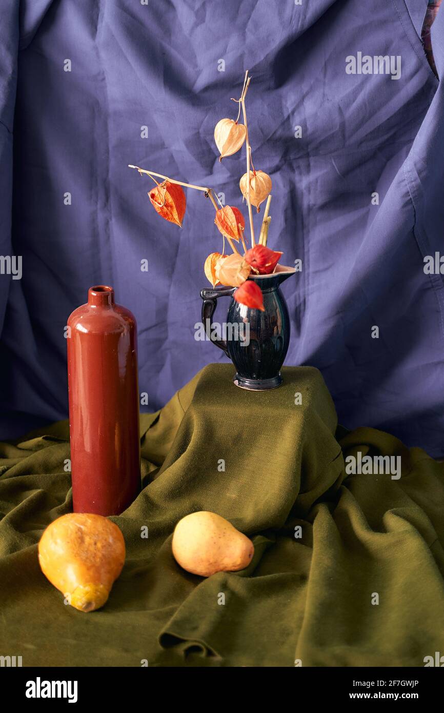 Simple still life. Ceramic vase with hibiscus. Purple and green ...