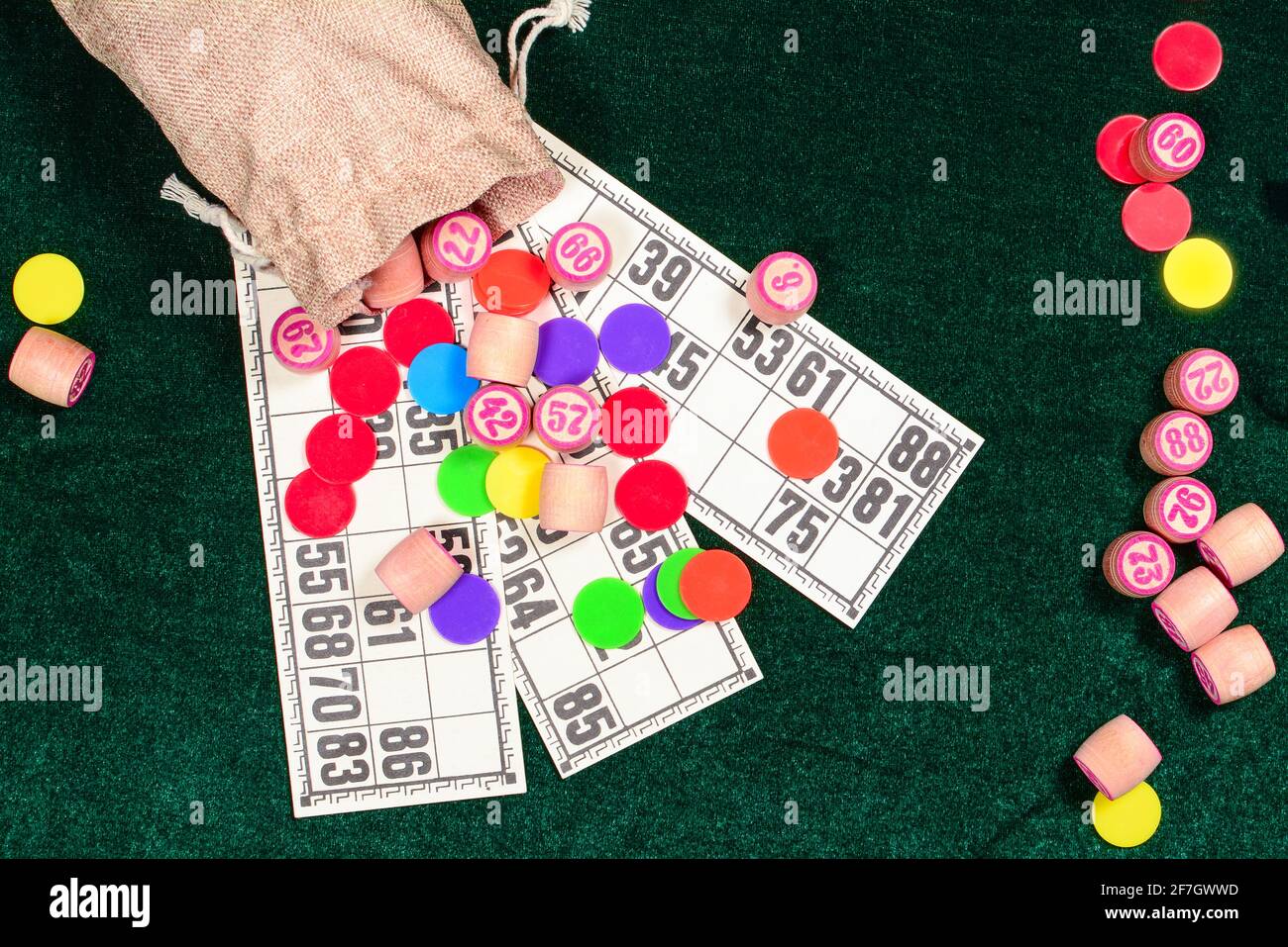 Lotto, classic family board game. Wooden barrels in jute bag, cards and ...