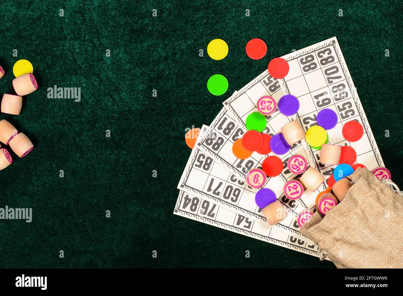 Lotto, classic family board game. Wooden barrels in jute bag, cards and ...