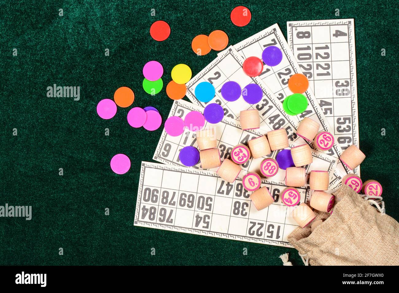 Lotto, a classic family board game. Wooden barrels in jute bag, cards ...