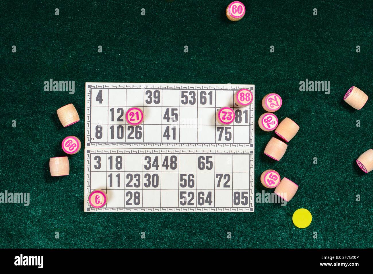 Lotto, classic family board game. Several wooden barrels with numbers ...