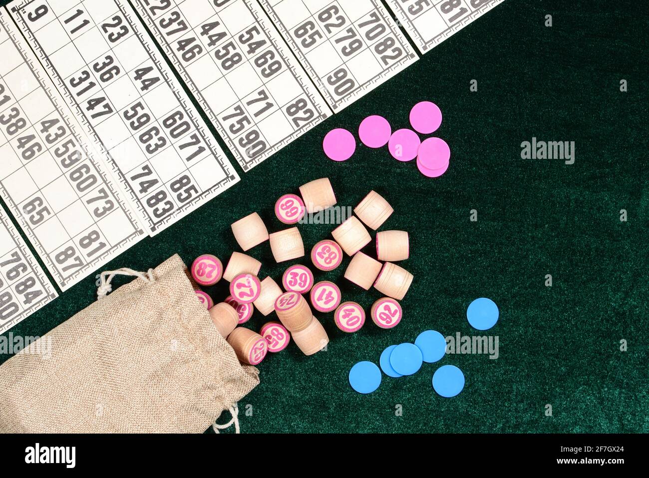 Lotto, classic family board game. Some wooden barrels, blue chips and ...