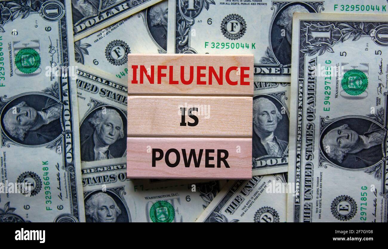 Influence is power symbol. Wooden blocks with words 'Influence is power ...