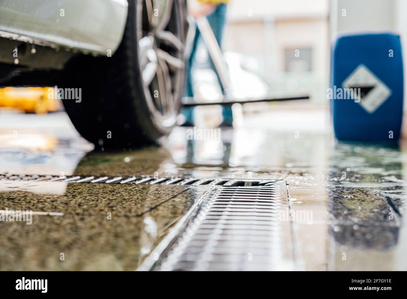 cleaning the floor after washing the car in the dishwasher Stock Photo ...