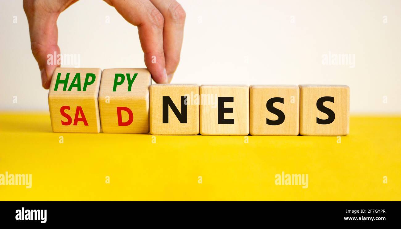 Happyness or sadness symbol. Businessman turns cubes and changes the ...