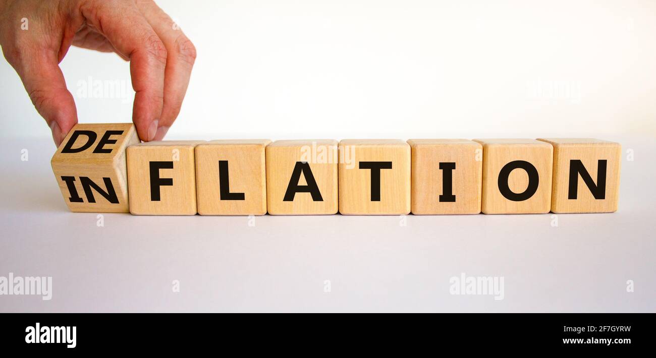 Inflation or deflation symbol. Businessman turns cubes and changes the ...