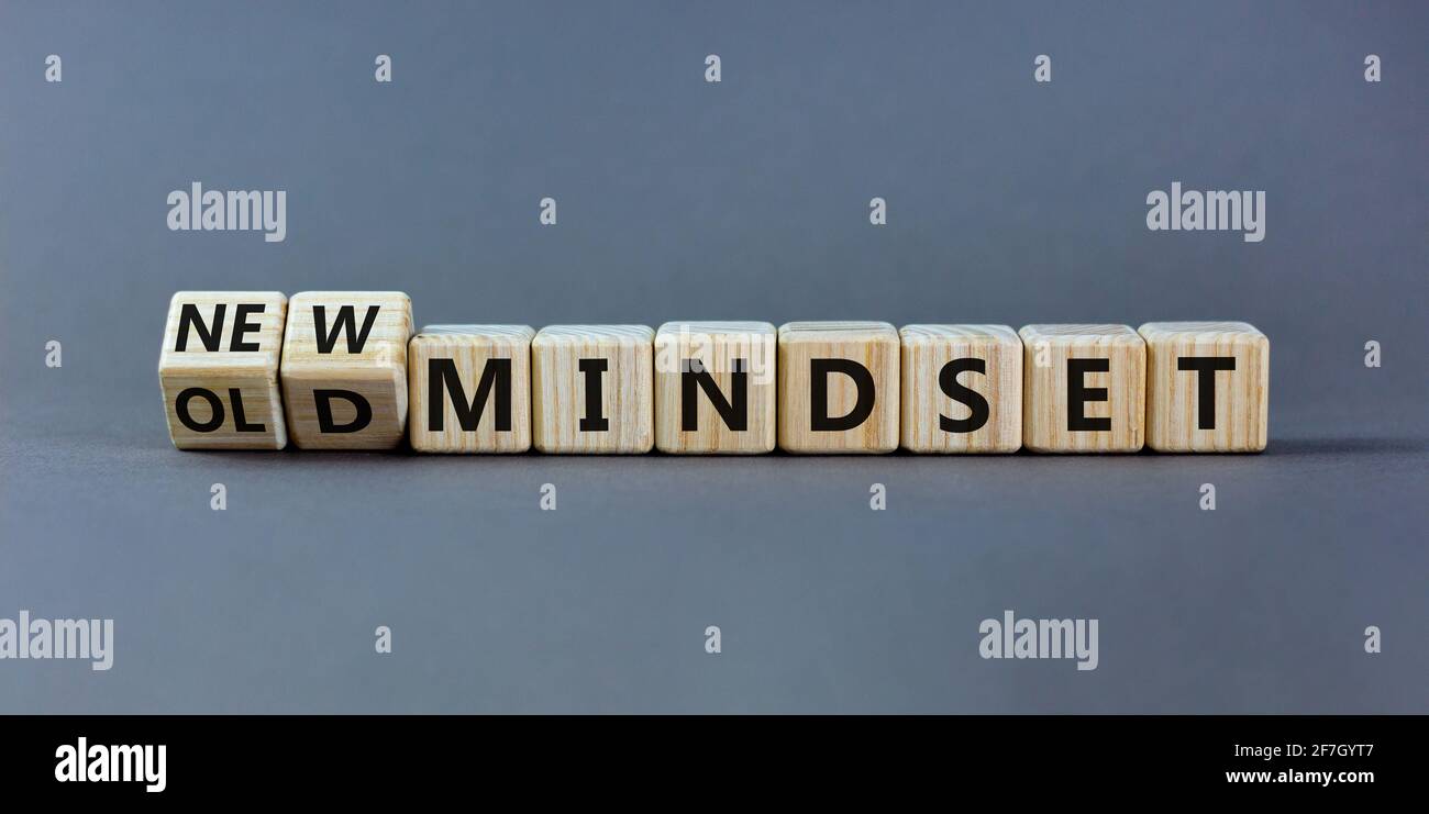 New vs old mindset symbol. Turned the wooden cube and changed words ...