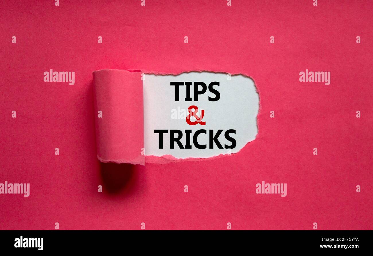 Tips and tricks symbol. Words 'Tips and tricks' appearing behind torn ...