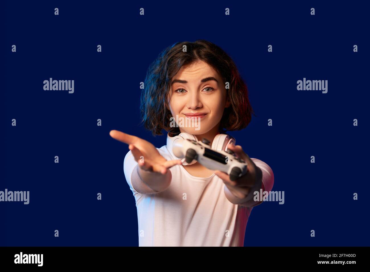 happy curly involved gamer girl playing video games Stock Photo - Alamy