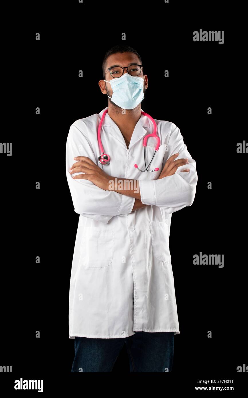 dark skin doctor with pink stethoscope on a black background Stock ...