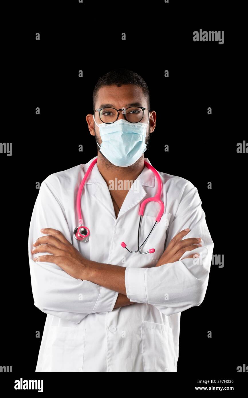 dark skin doctor with pink stethoscope on a black background Stock ...