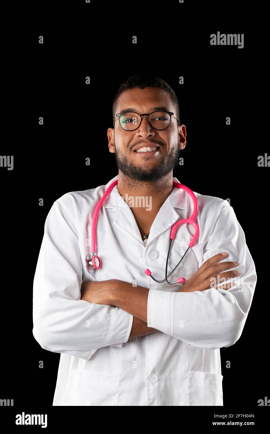 dark skin doctor with pink stethoscope on a black background Stock ...