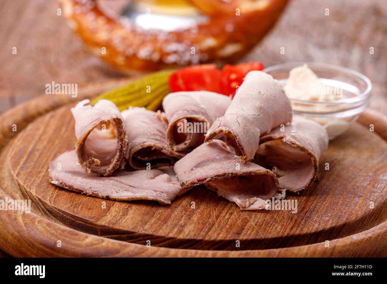 bavarian sliced cold pork on wood Stock Photo - Alamy