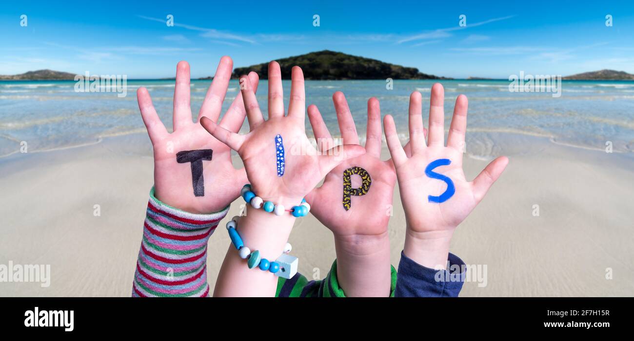 Children Hands Building Word Tips, Ocean Background Stock Photo - Alamy