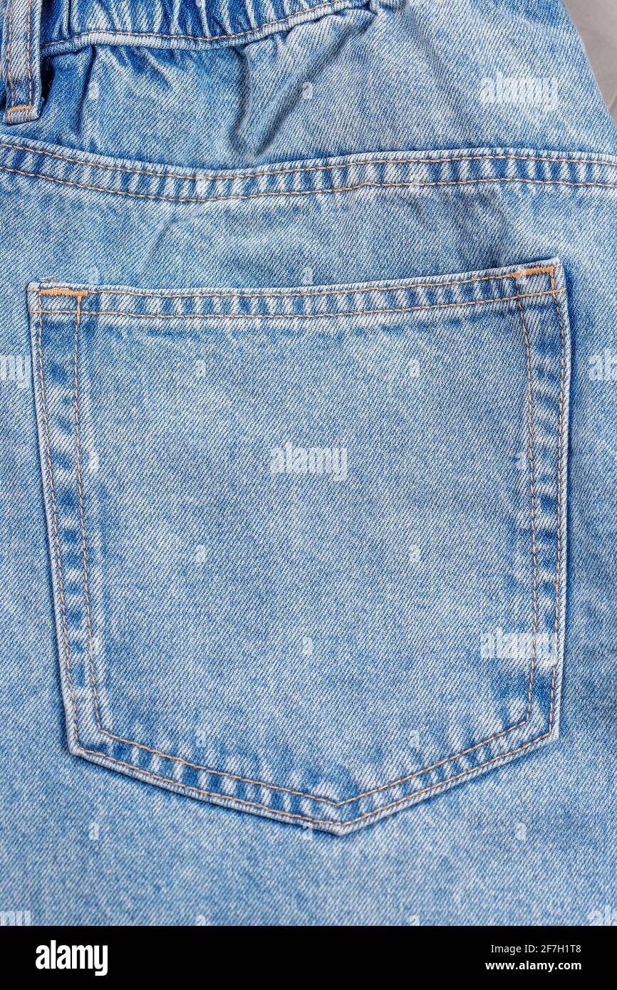 Close-up of blue jeans pocket showing fabric texture and stitching ...