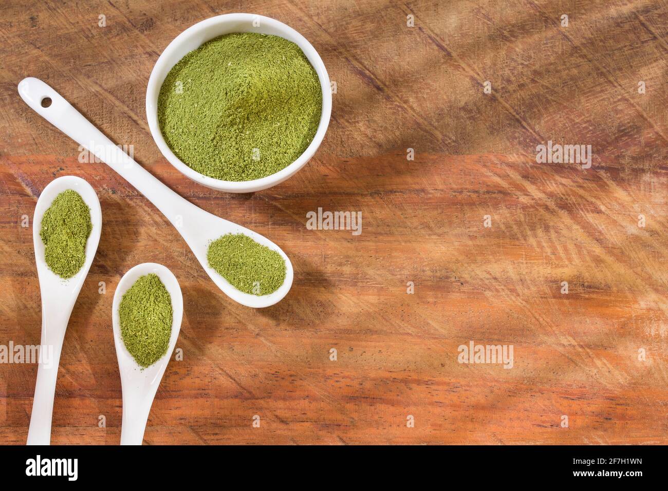 Organic moringa powder on wooden background - Moringa oleifera Stock ...