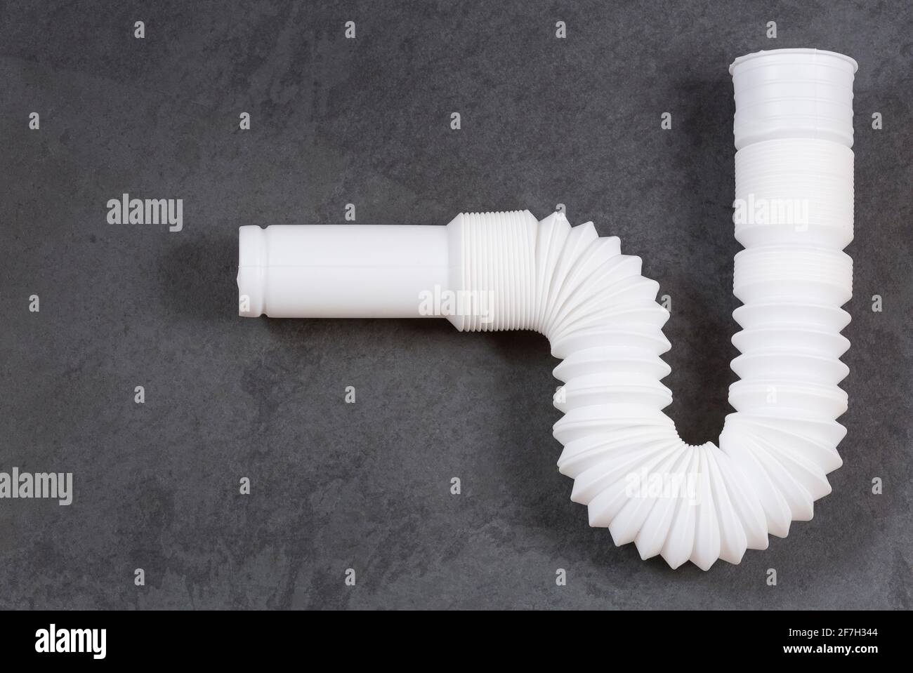 Plastic pipe with water trap, isolated - Plastic flexible siphon. Top ...