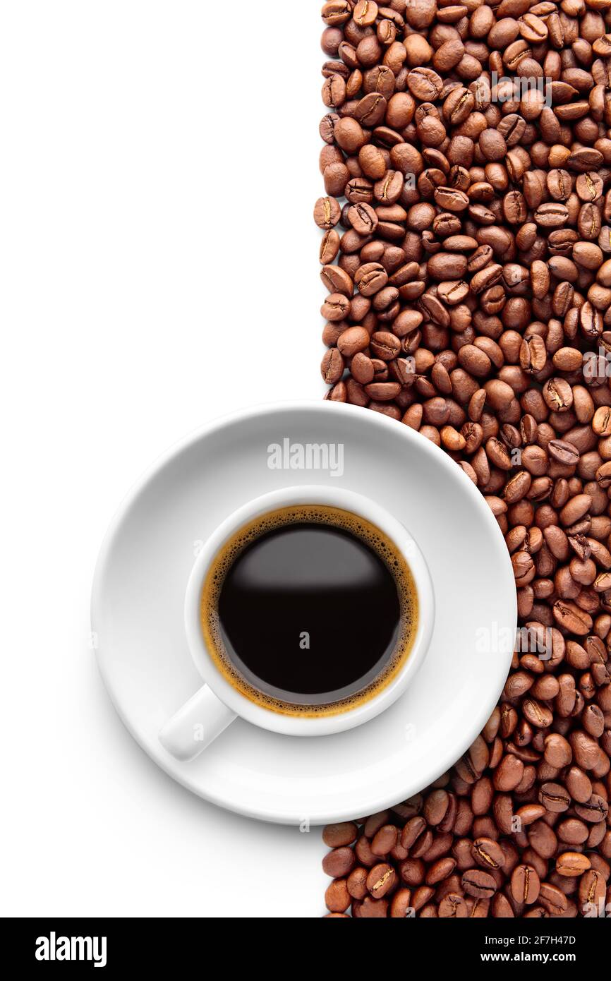 Coffee cup on beans background Stock Photo - Alamy