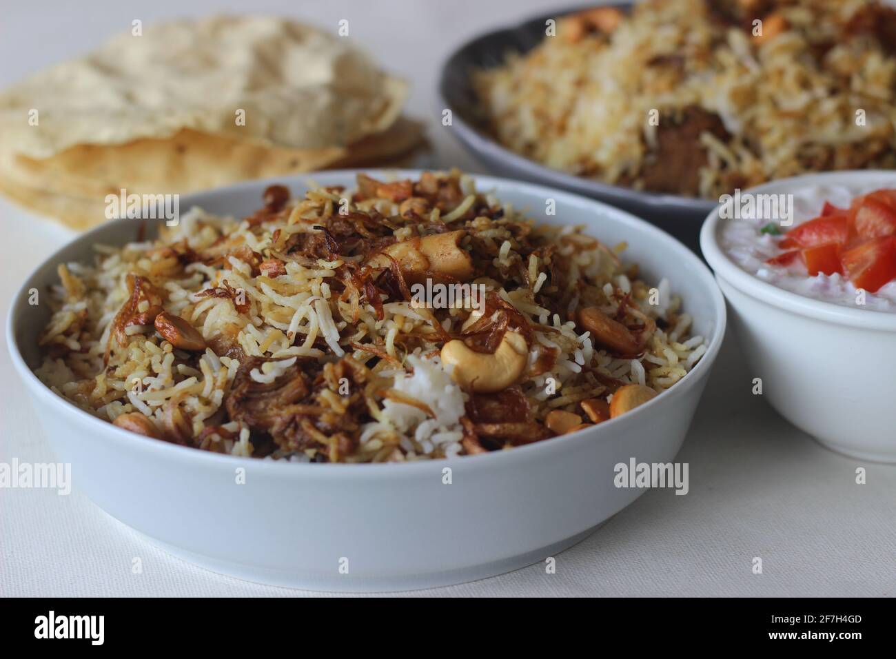 Mutton Biryani. A dish cooked with spices layered between mildly spiced ...
