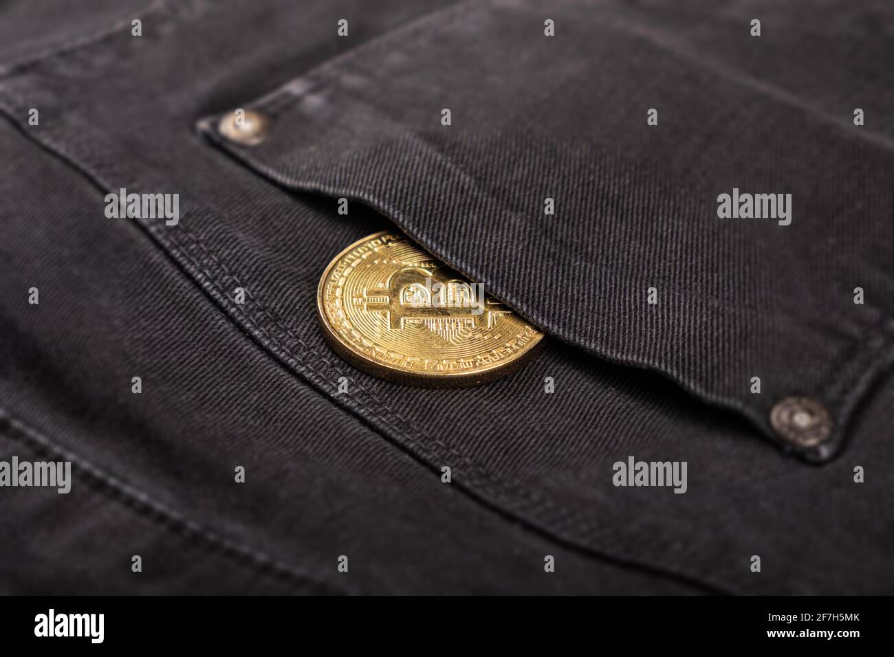 metal bitcoin coin in pants pocket, cryptocurrency, cost management ...