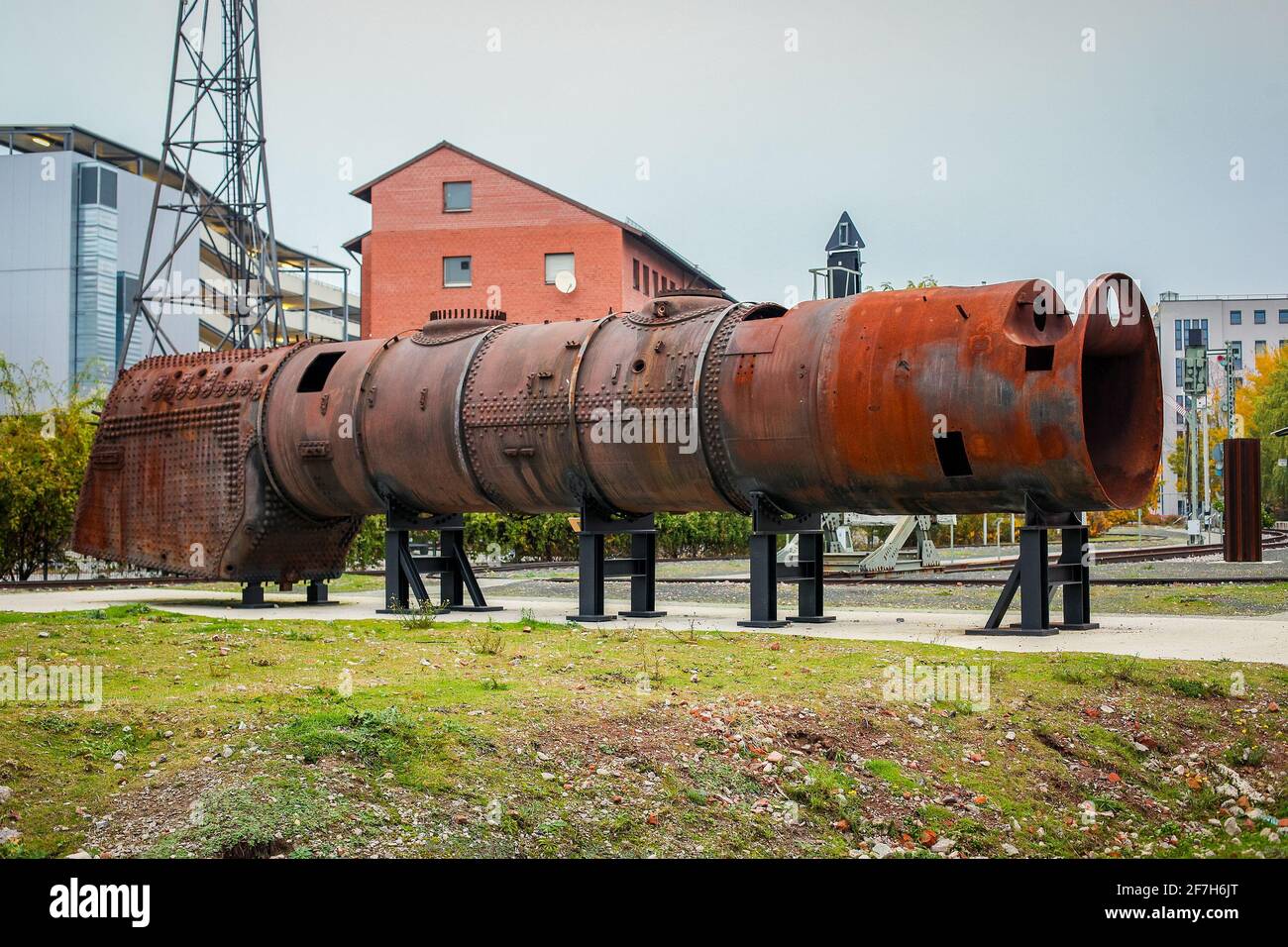 Big iron boiler of a vintage steam locomotive on a display. Educational ...