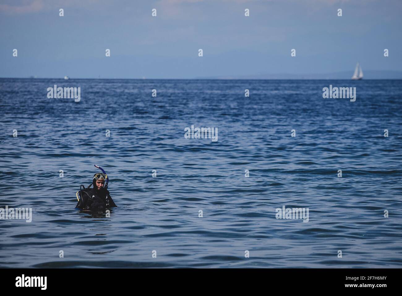 Women standing beach in shallow hi-res stock photography and images - Alamy