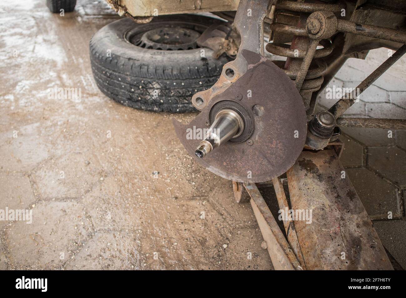 Exposed or stripped wheel axle of a car, the place where usually hub ...