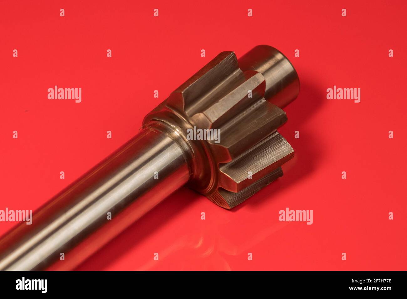 Detail or close up of a chrome axle with teeth as used in the power ...