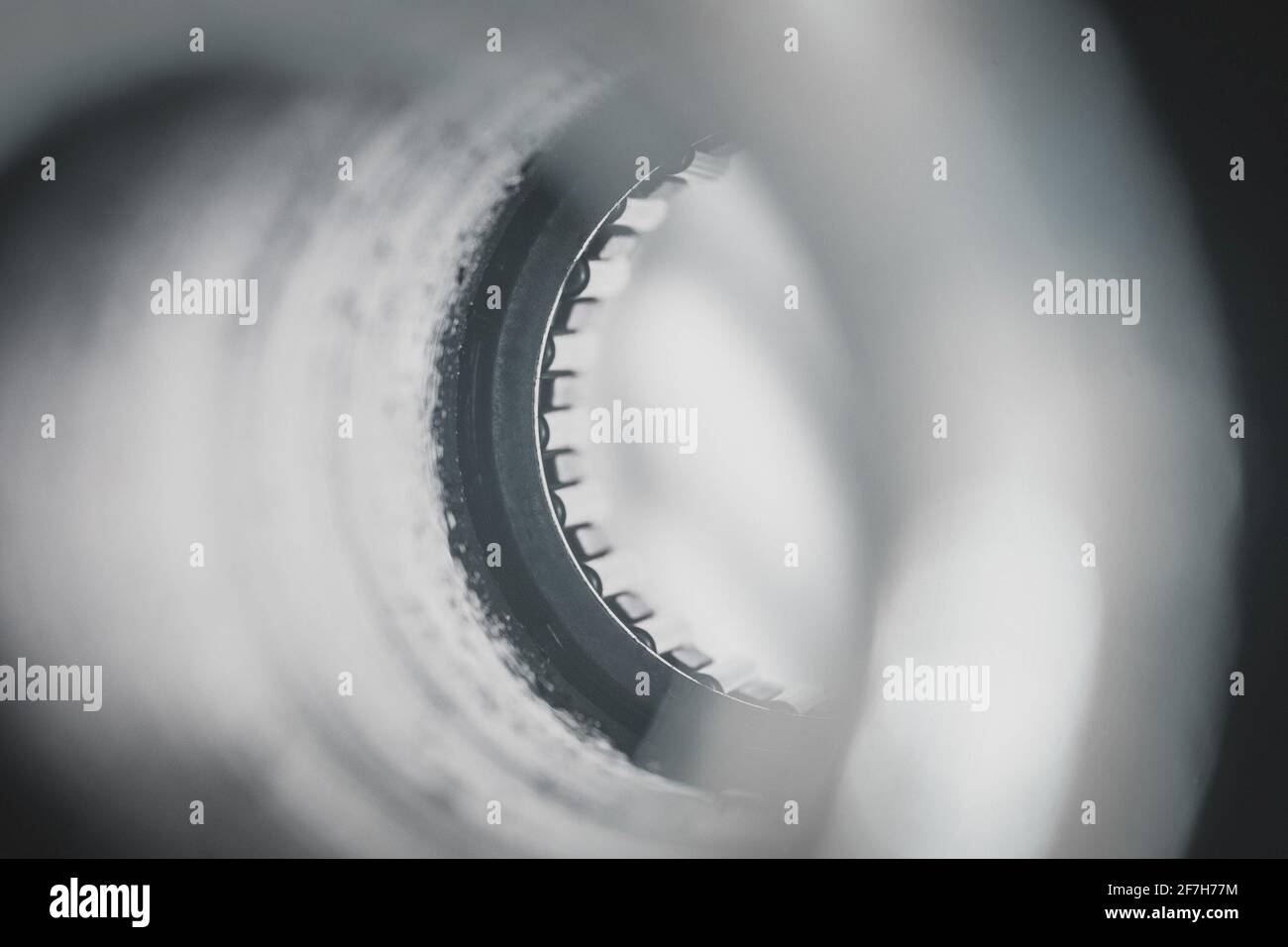 Detail or macro photo of a roller needle bearing installed in a pipe or ...