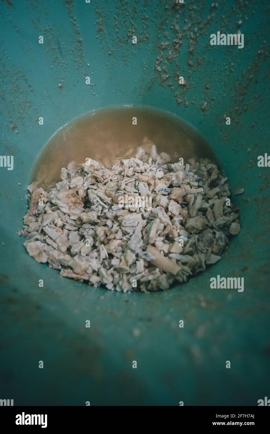 Scale deposit from a boiler or a water heater in a bathroom lying in a ...