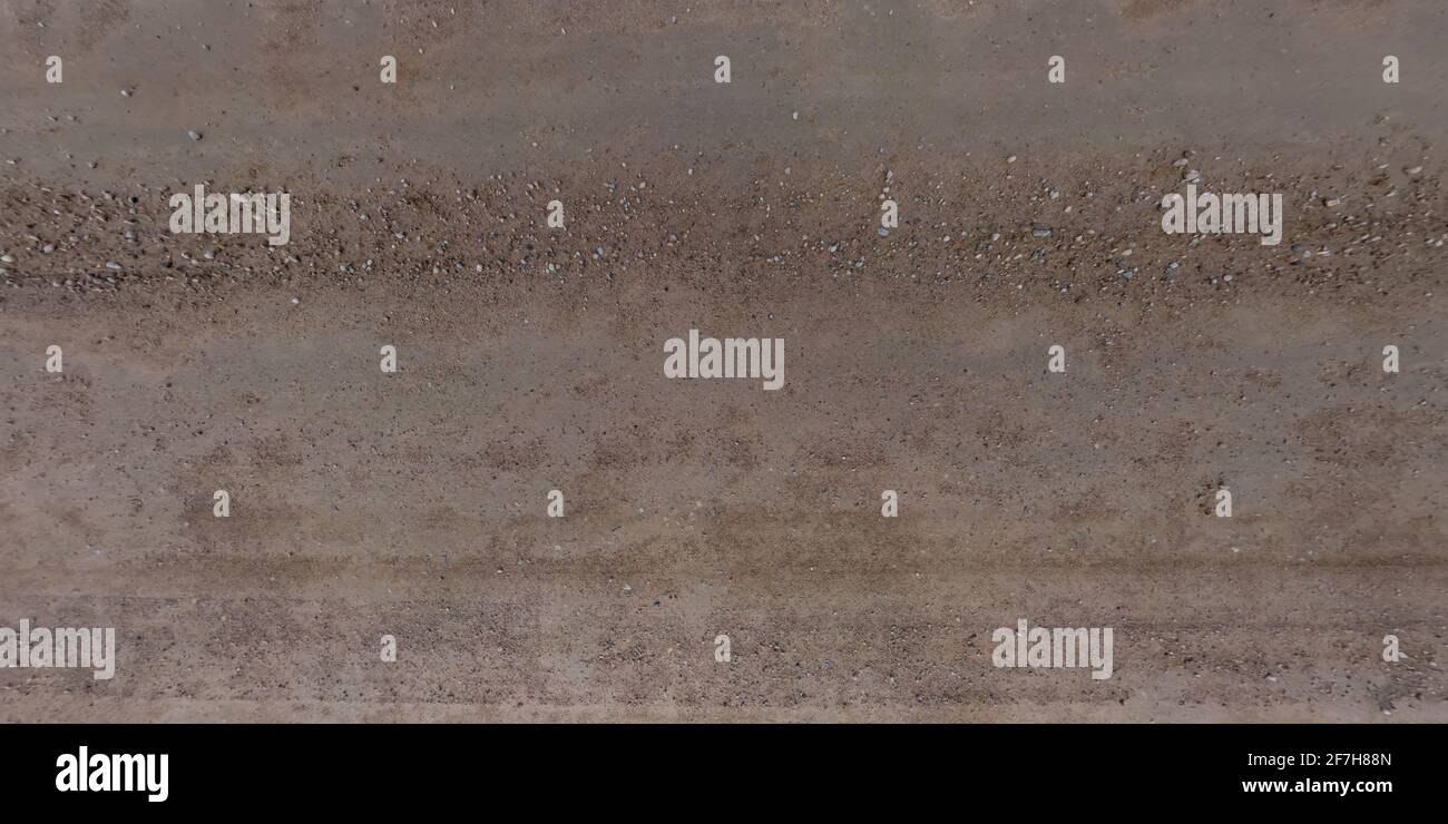 view from above on car tire tracks on texture of gravel road Stock ...