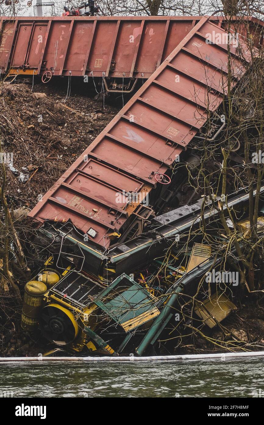 Closeup of a train wreck. The train drove from a bank into the river ...