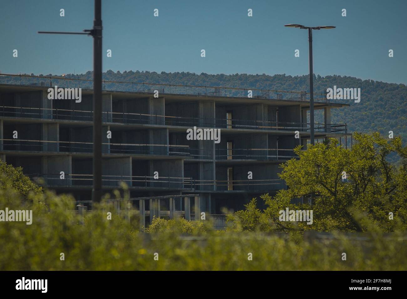 An abandoned construction site of a commercial building is waiting ...