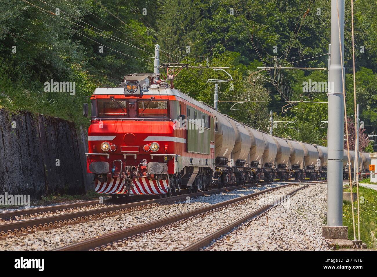 Train hauling waggons with cement. Freight train with a long series of ...